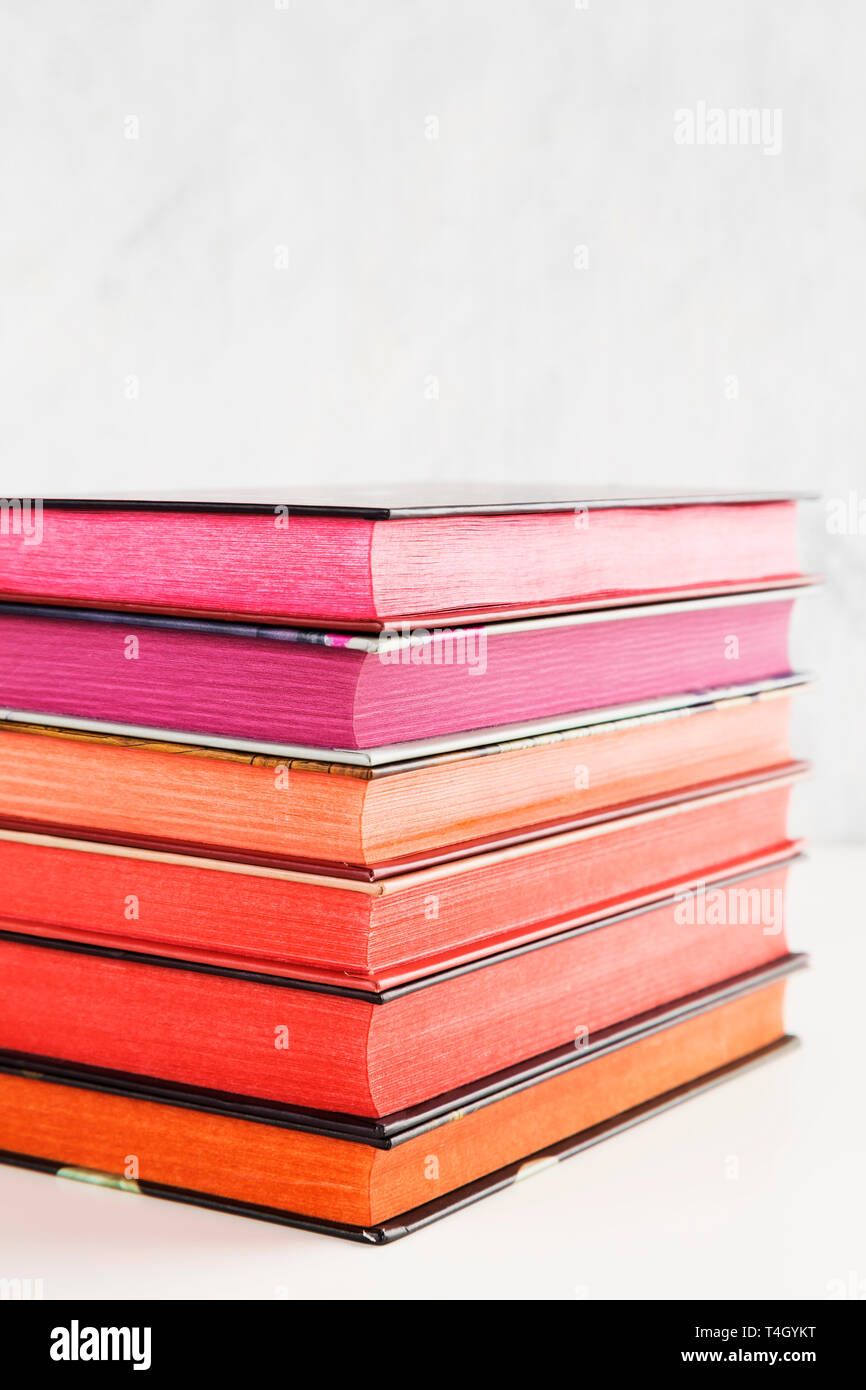 Pile of books with color stack on white background Stock Photo - Alamy