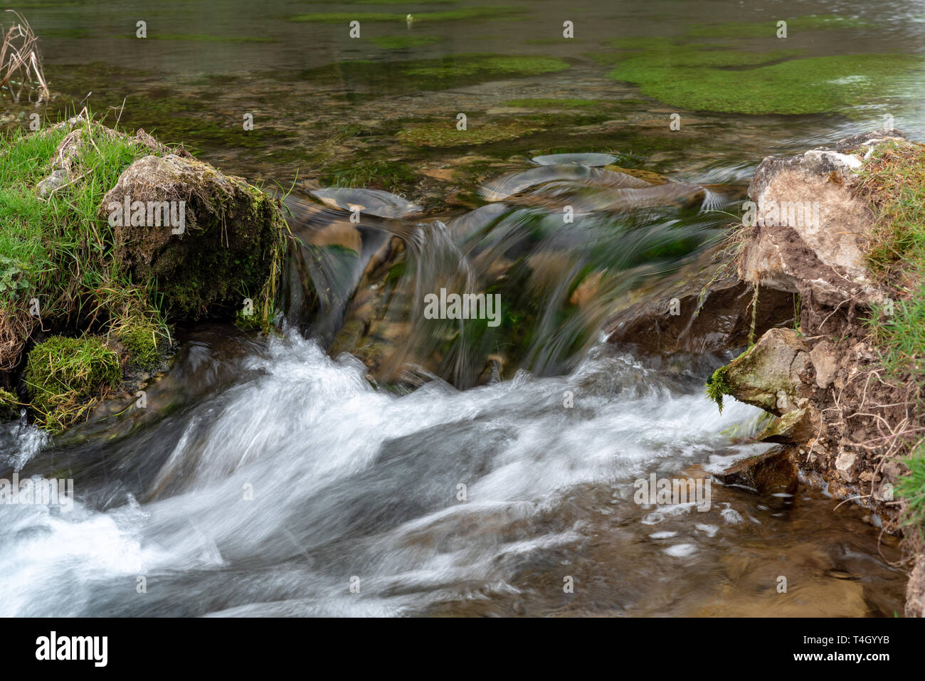 Flowing water, and waterfall cascades on the River Lathkill, Lathkill ...