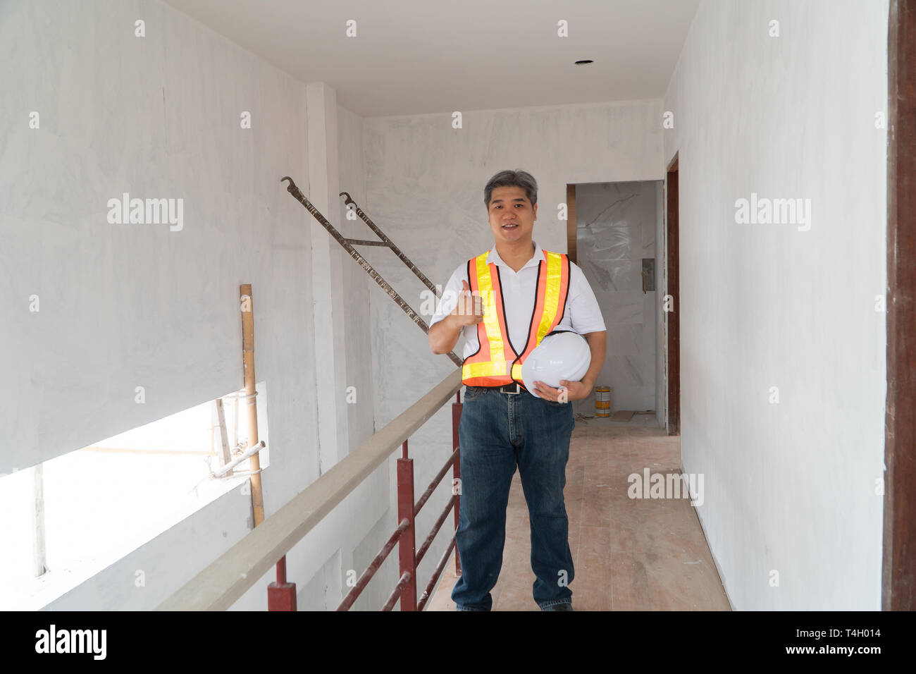 Asian professional engineer working in house construction site for ...