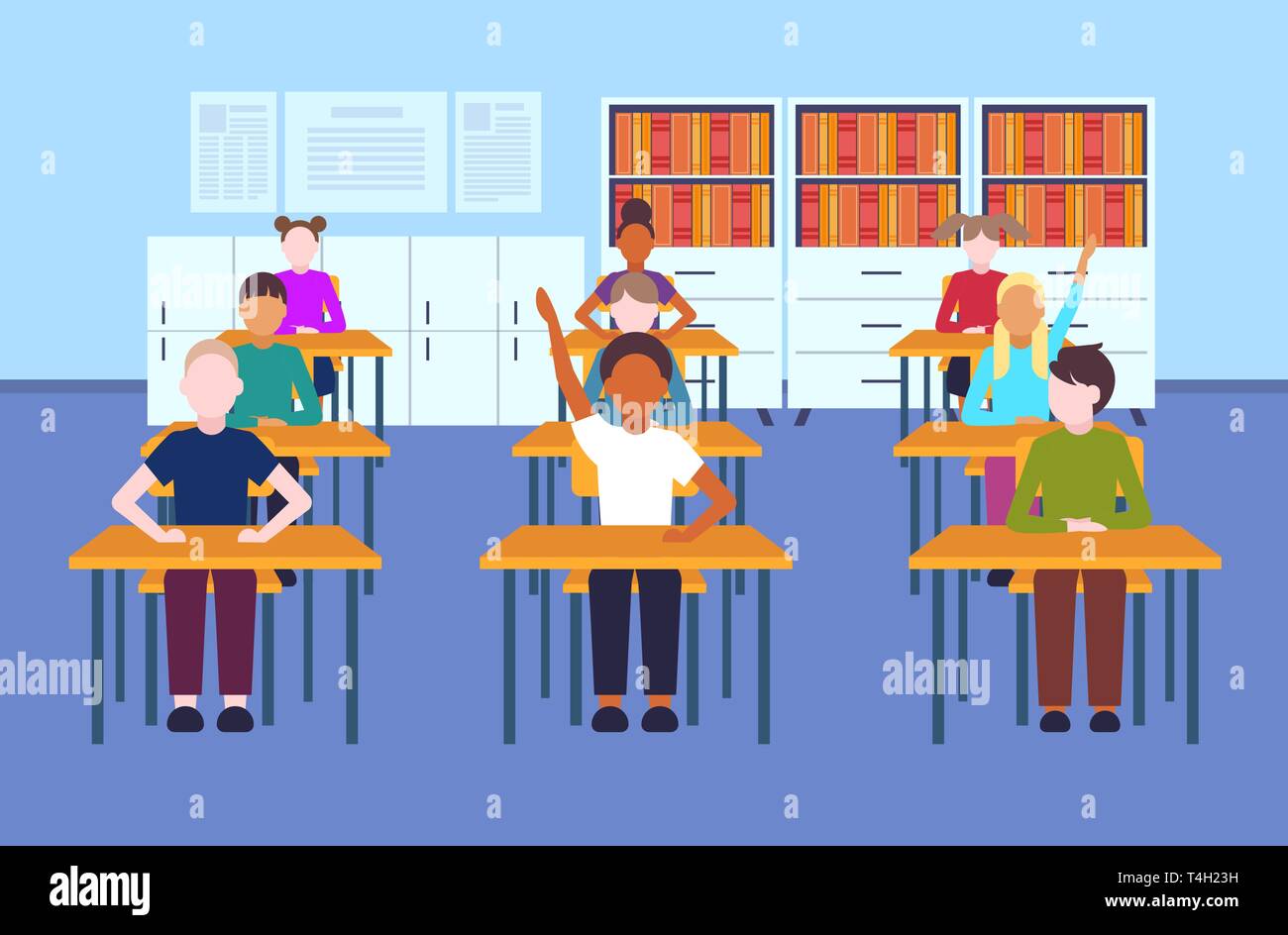mix race pupils sitting desks raising hands during lesson education ...