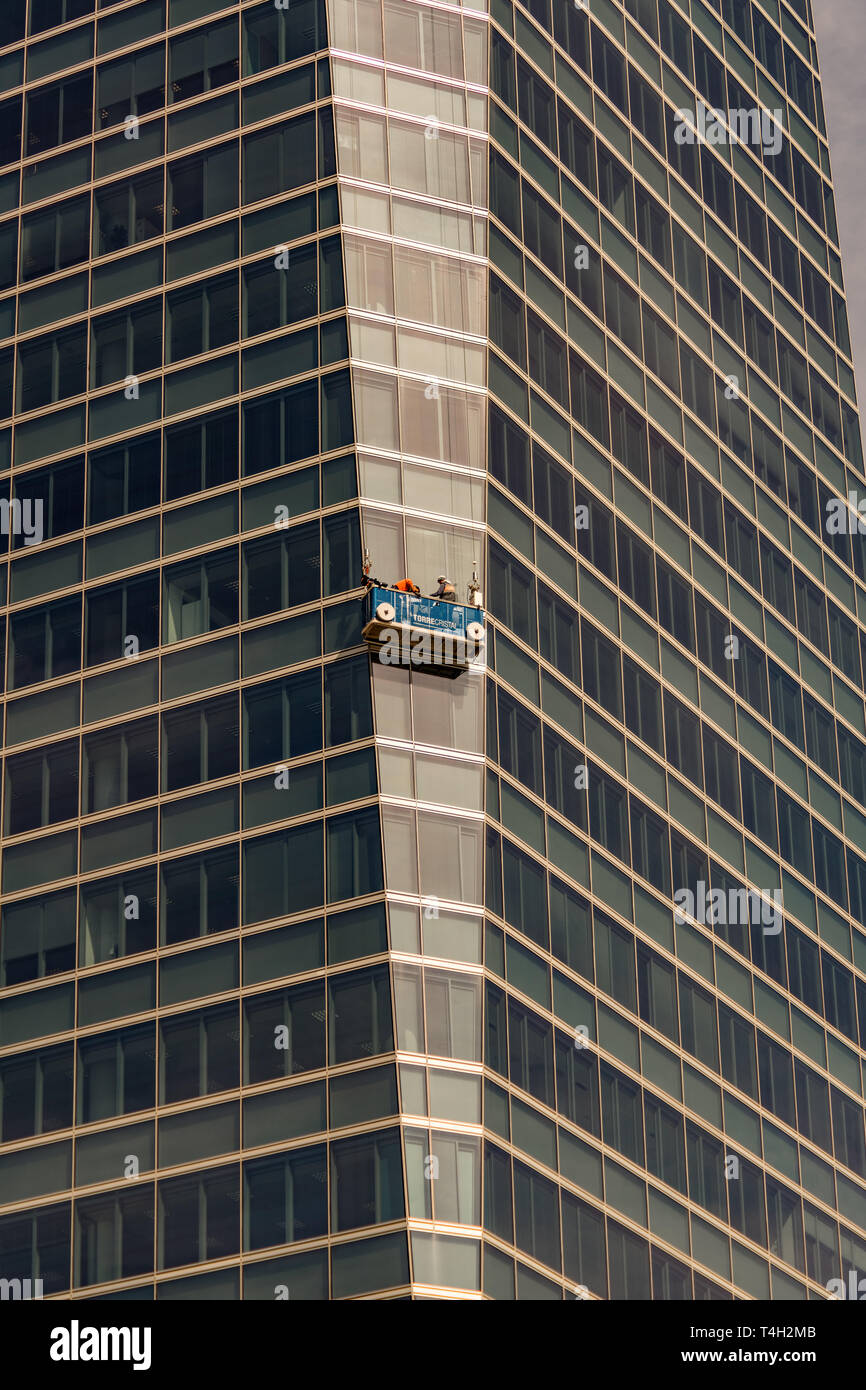 window cleaners in cradle on high rise office block Stock Photo - Alamy