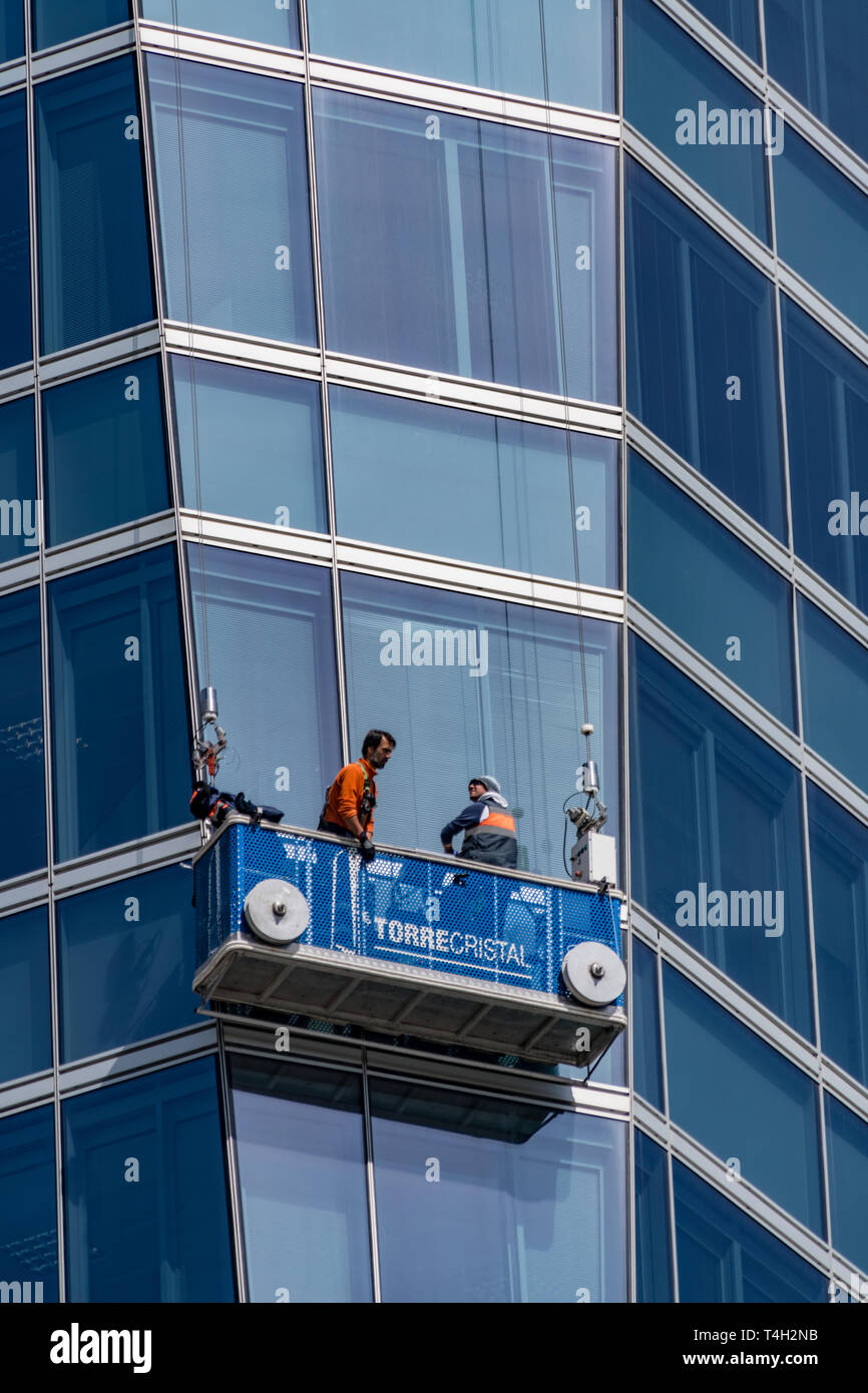 window cleaners in cradle on high rise office block Stock Photo - Alamy