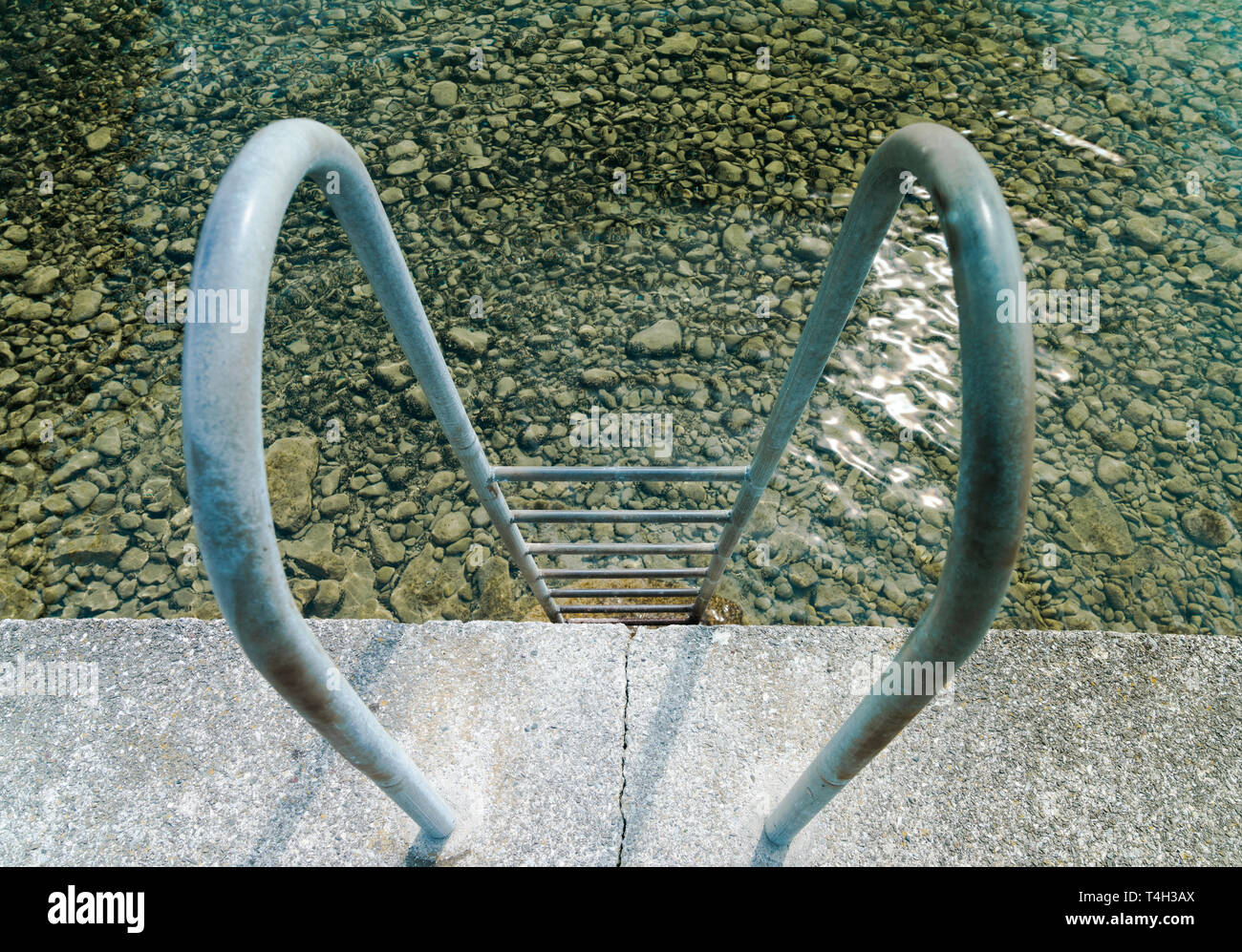 long metal curved stairs lead down into the waters of Lake Constance ...