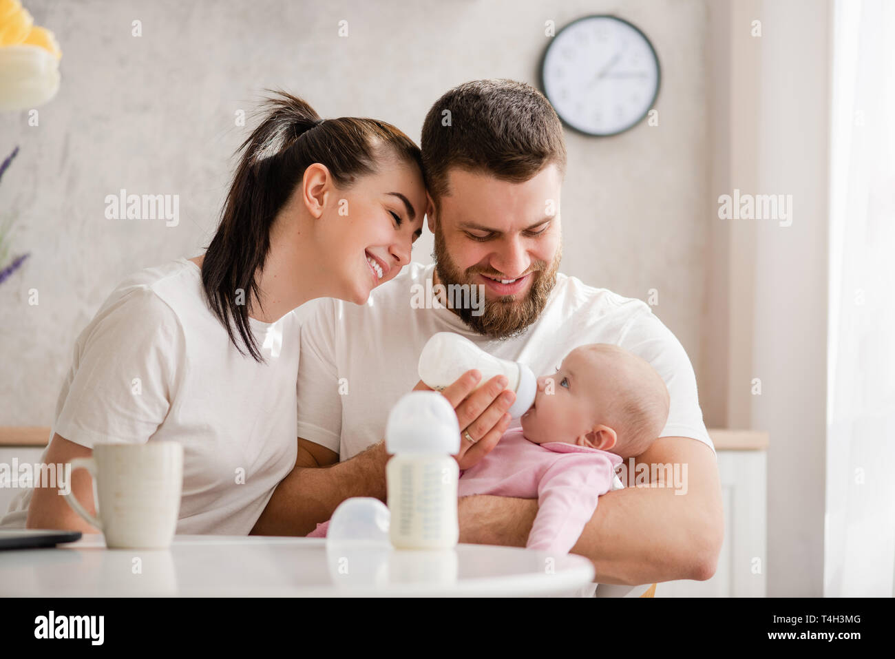 Man feeding milk baby girl hi-res stock photography and images - Alamy