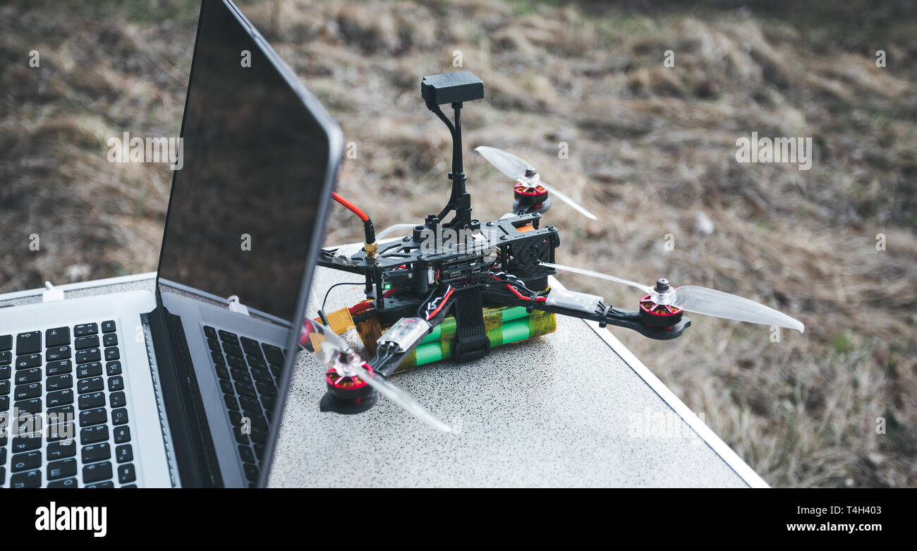 FPV drone lies on the table near the laptop and control panel Stock ...