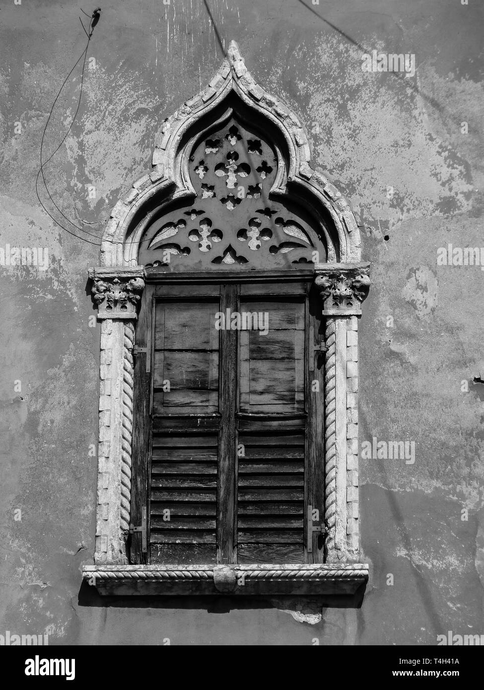 Distressed window in Verona Stock Photo - Alamy
