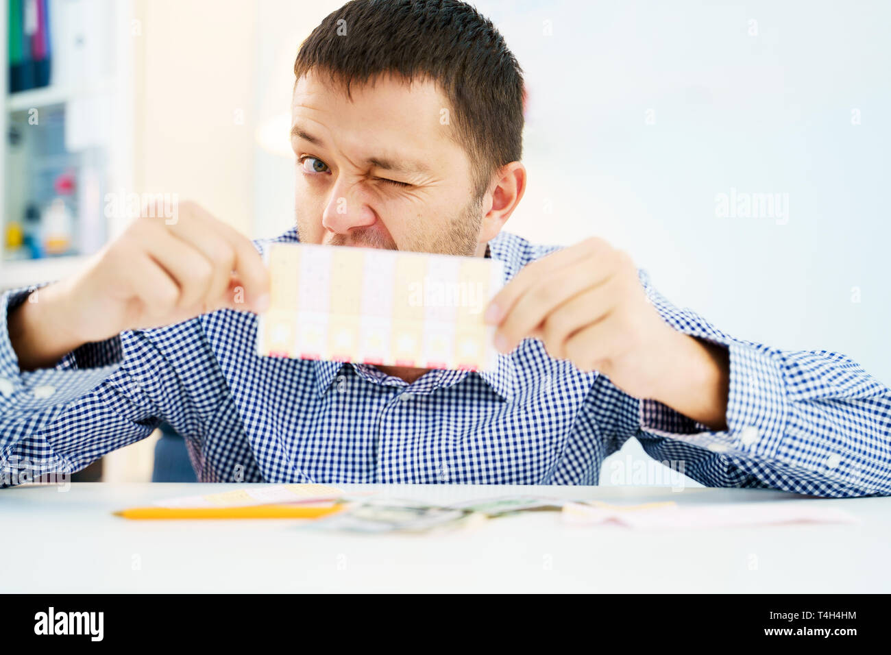 Man with lottery ticket hi-res stock photography and images - Alamy