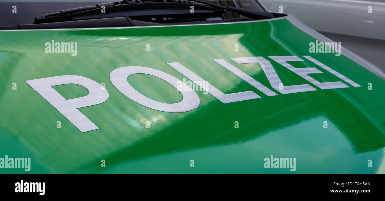 CENTRAL STATIONS, MUNICH, APRIL 6, 2019: green german police print on a ...