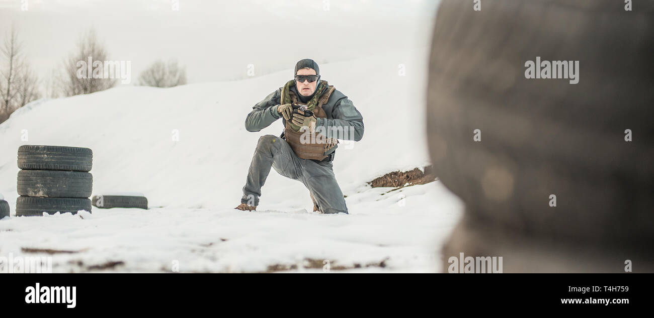 Crouching position military and army special forces soldier have combat ...