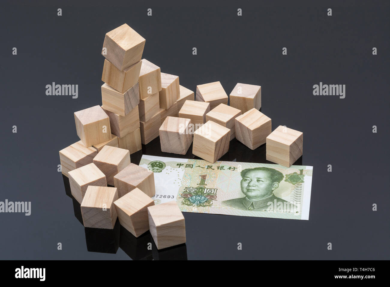 Chinese 1 Yuan bill & scattered wooden bricks. Collapse of Chinese ...