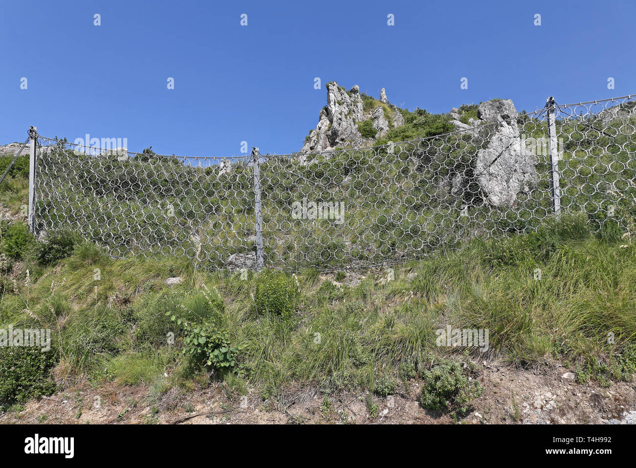 Steel Safety Net at Slope Hill for Road Protection Stock Photo - Alamy