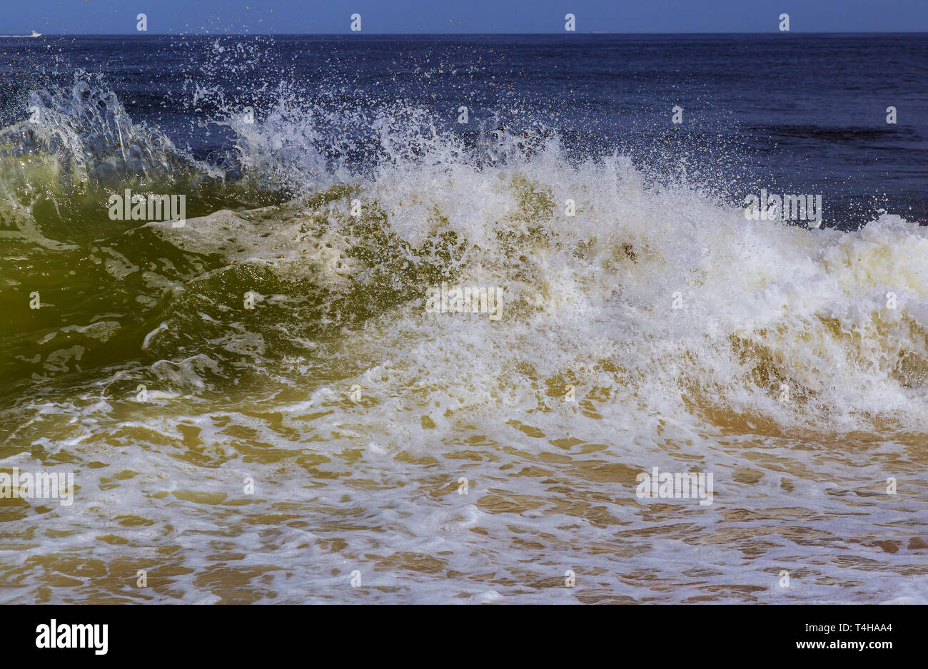 Rough seas and inclement weather breaking ocean generated waves Stock ...