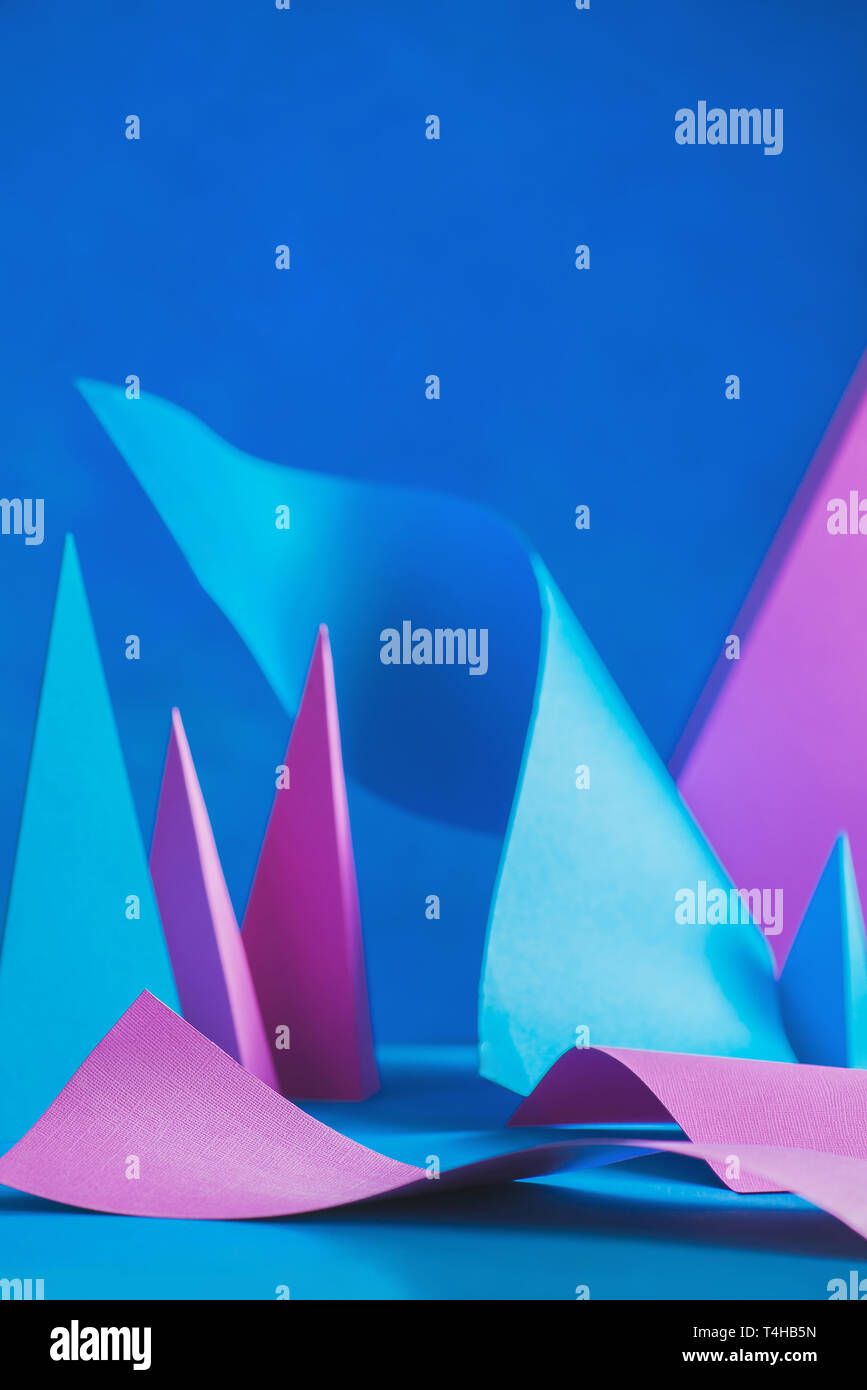 Papercraft shapes, pyramids, and curves in abstract paper sculpture ...