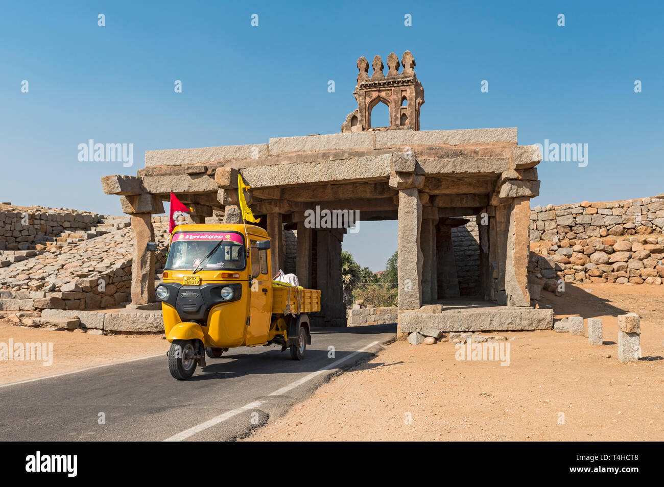 Auto-riksha drives through Talarigatta Gate, Hampi, India Stock Photo ...