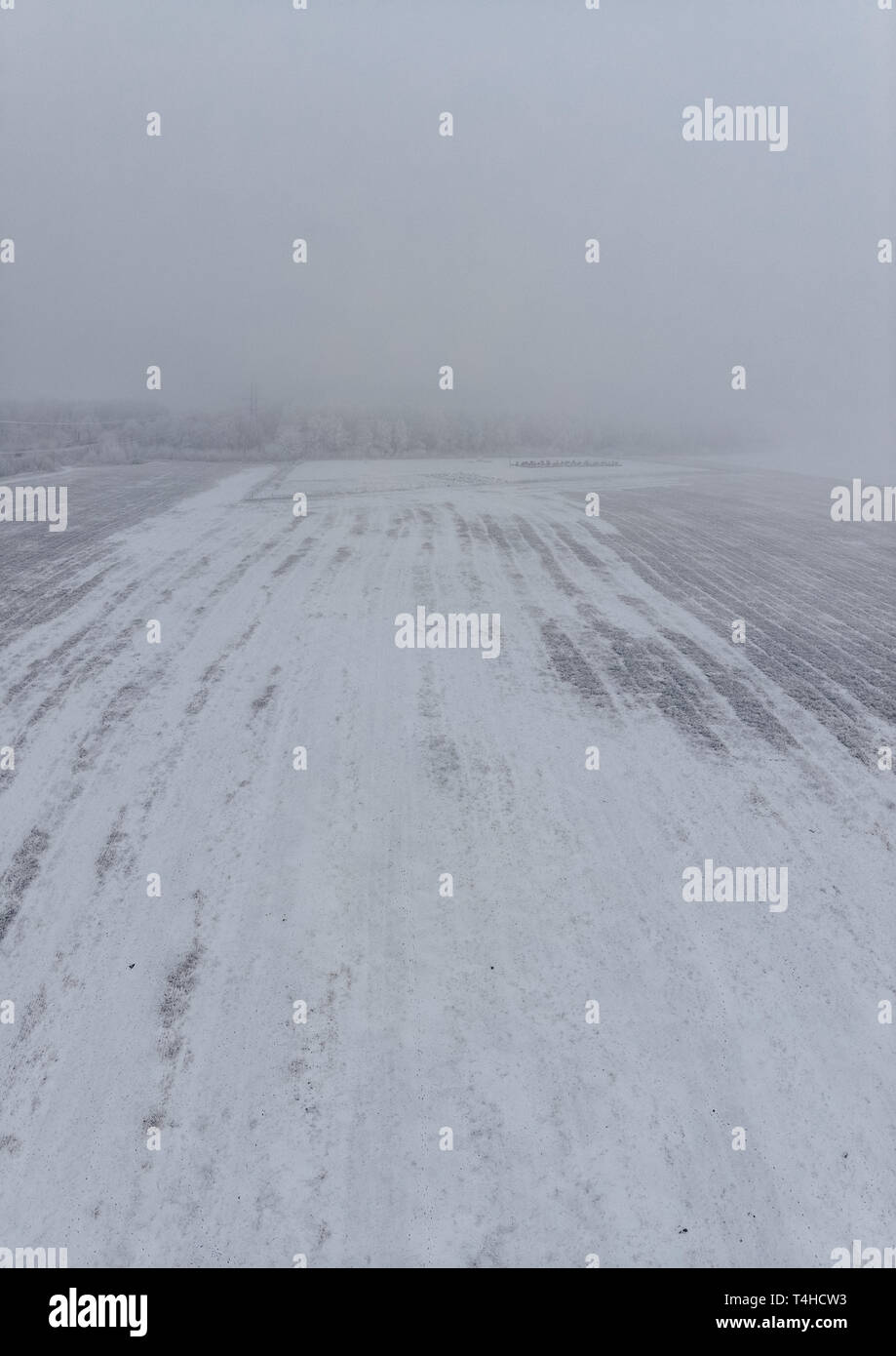 Drone flight above frozen field hi-res stock photography and images - Alamy