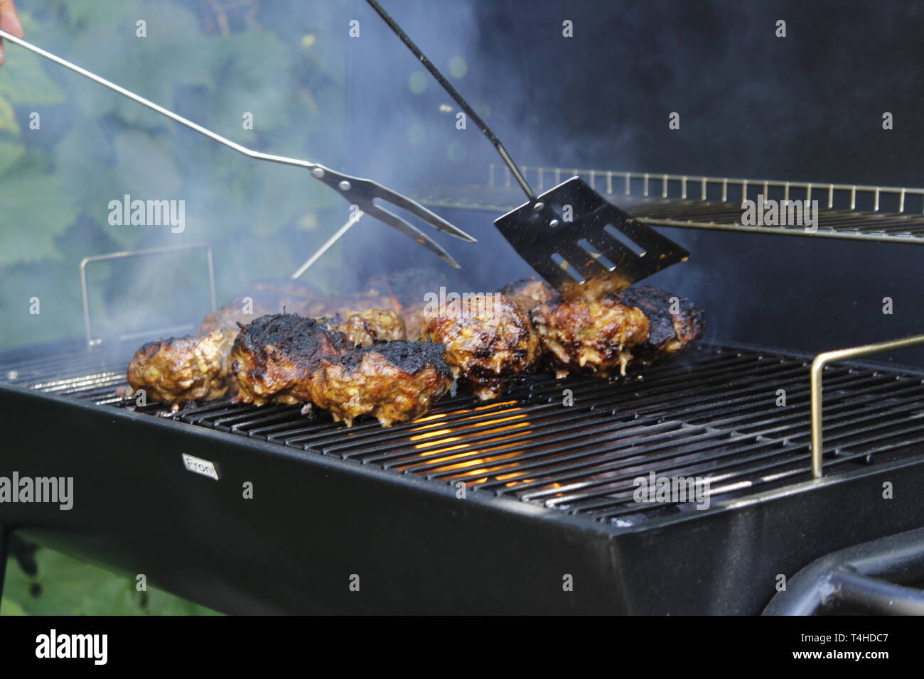 Barbecue of meat and fish Stock Photo - Alamy