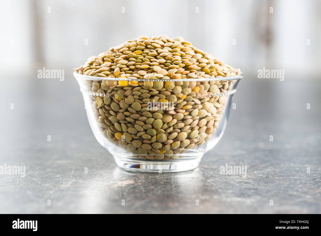 Uncooked dried lentil in glass bowl Stock Photo - Alamy