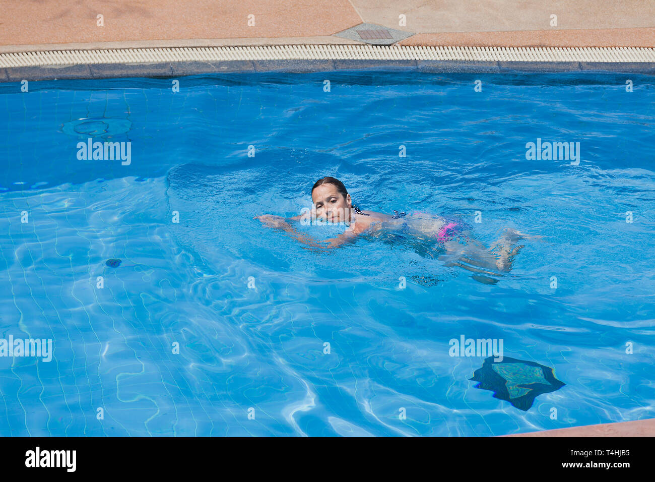 Adult woman in blue swimsuit hi-res stock photography and images - Alamy