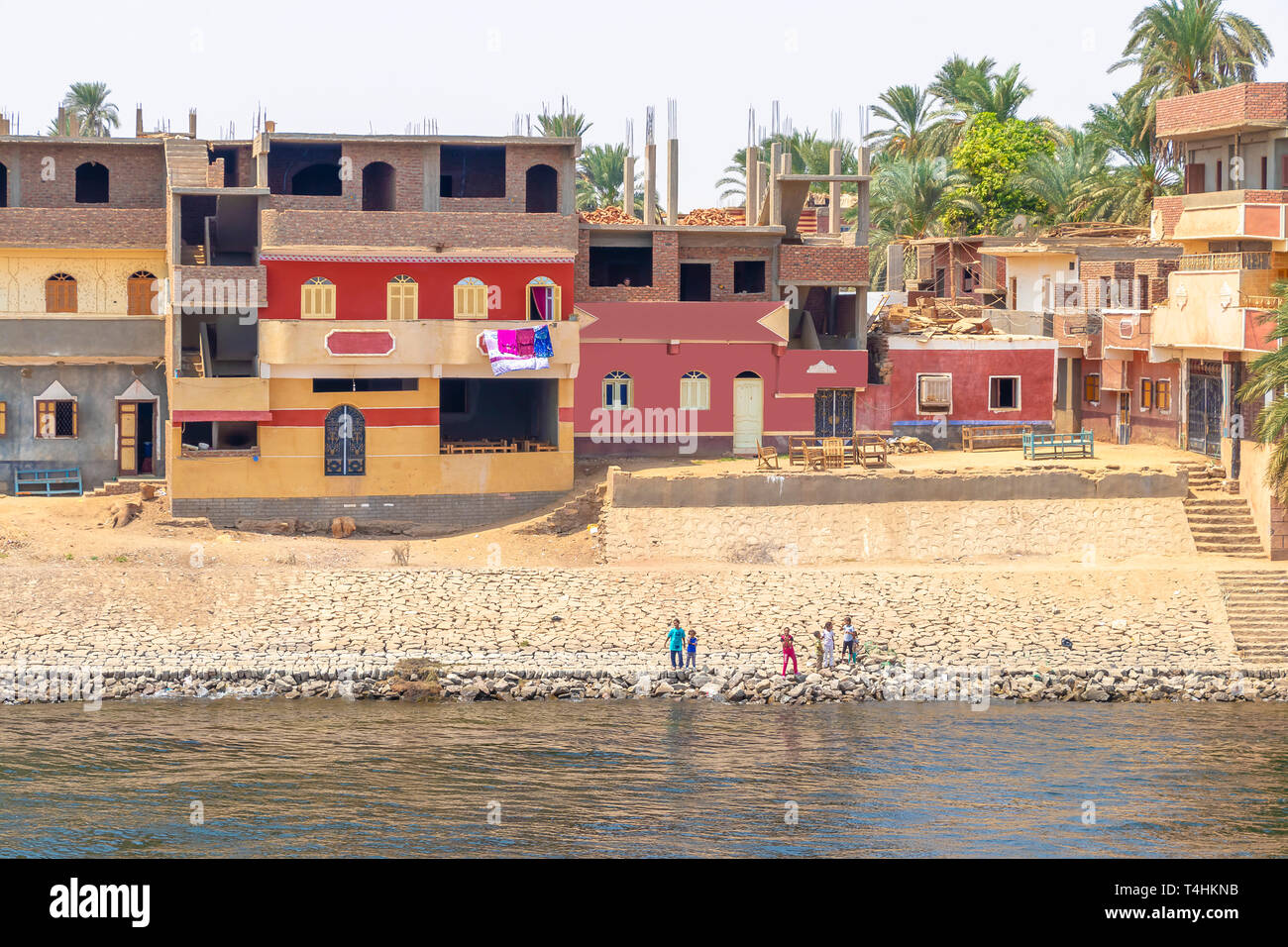 Aswan, Egypt - September 13, 2018: Children waving to Nile Cruise ...