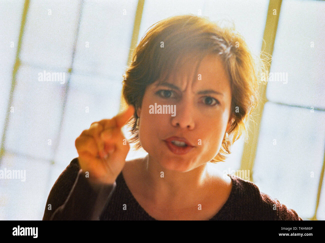 Angry young woman pointing finger, USA Stock Photo - Alamy