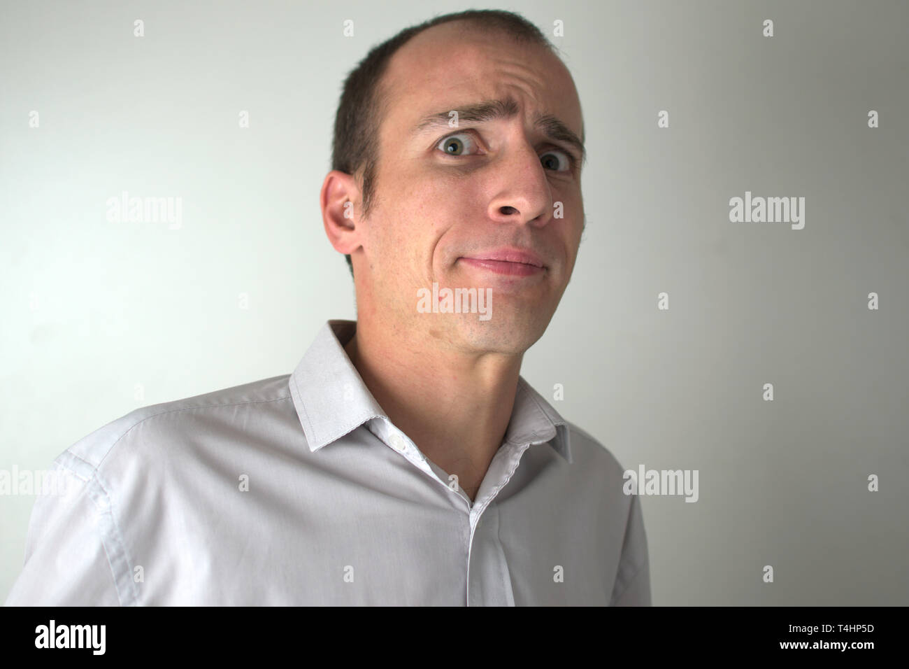 Studio shot of a man with a troubled expression in his face Stock Photo ...