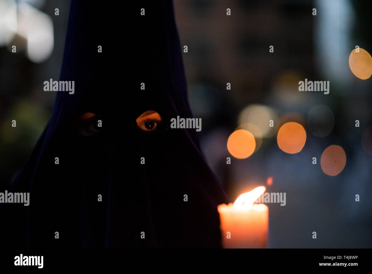 A penitent is seen during the Holy Wednesday procession in Granada ...