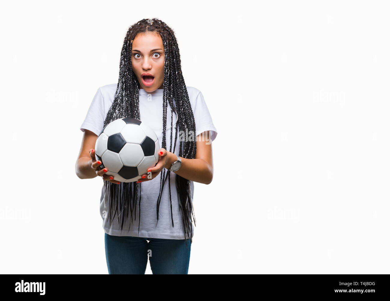 Young braided hair african american girl holding soccer ball over ...
