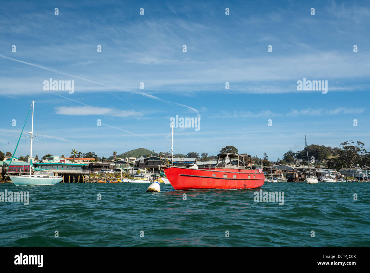 Boats in a Bay. Beautiful Blue Sky Background Stock Photo - Alamy