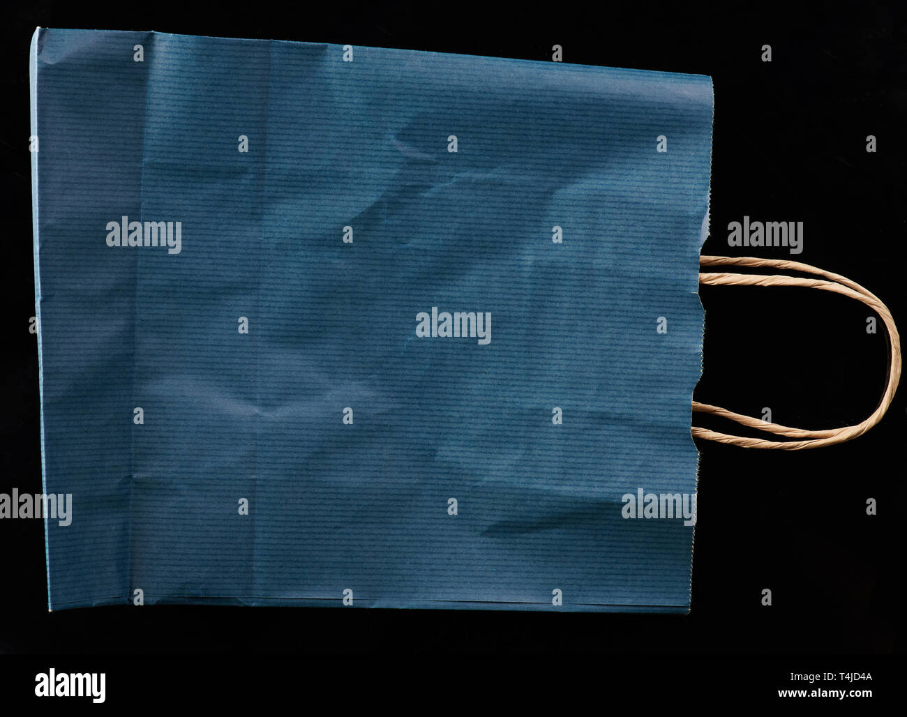 Blue paper shopping bag side view isolated on black background Stock ...
