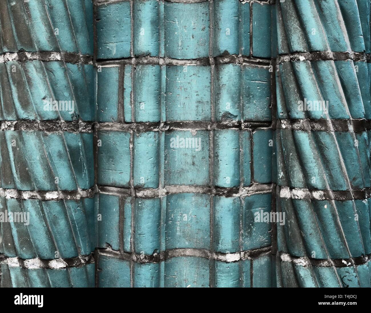 Beautiful aged and weathered blue brick wall surfaces in a close up ...