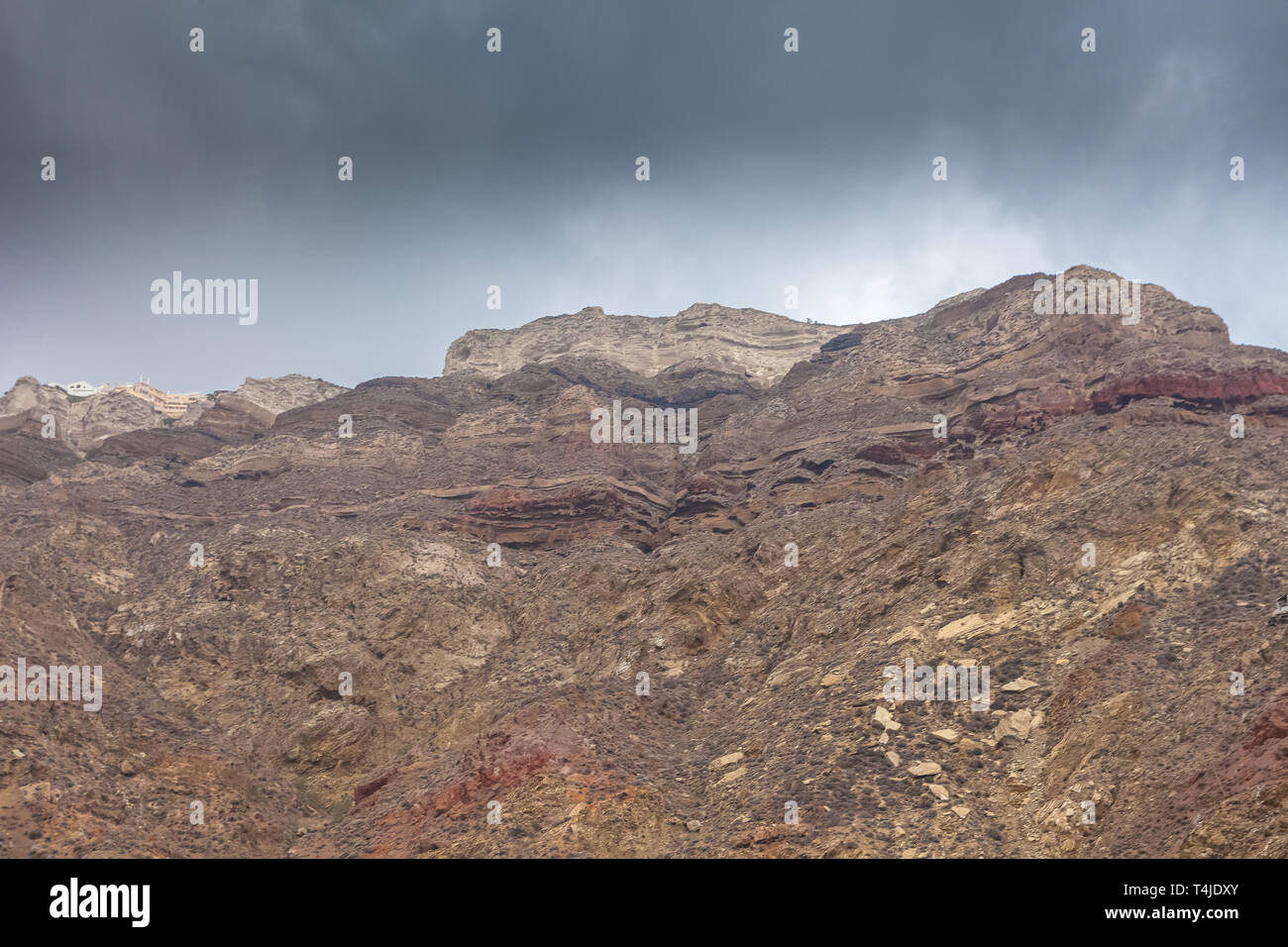 Colorful cliff of caldera in the island of Santorini Stock Photo - Alamy