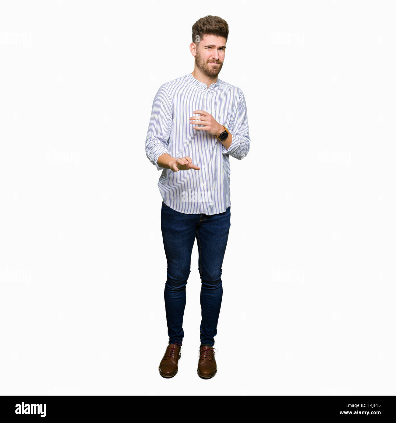 Young handsome man disgusted expression, displeased and fearful doing ...