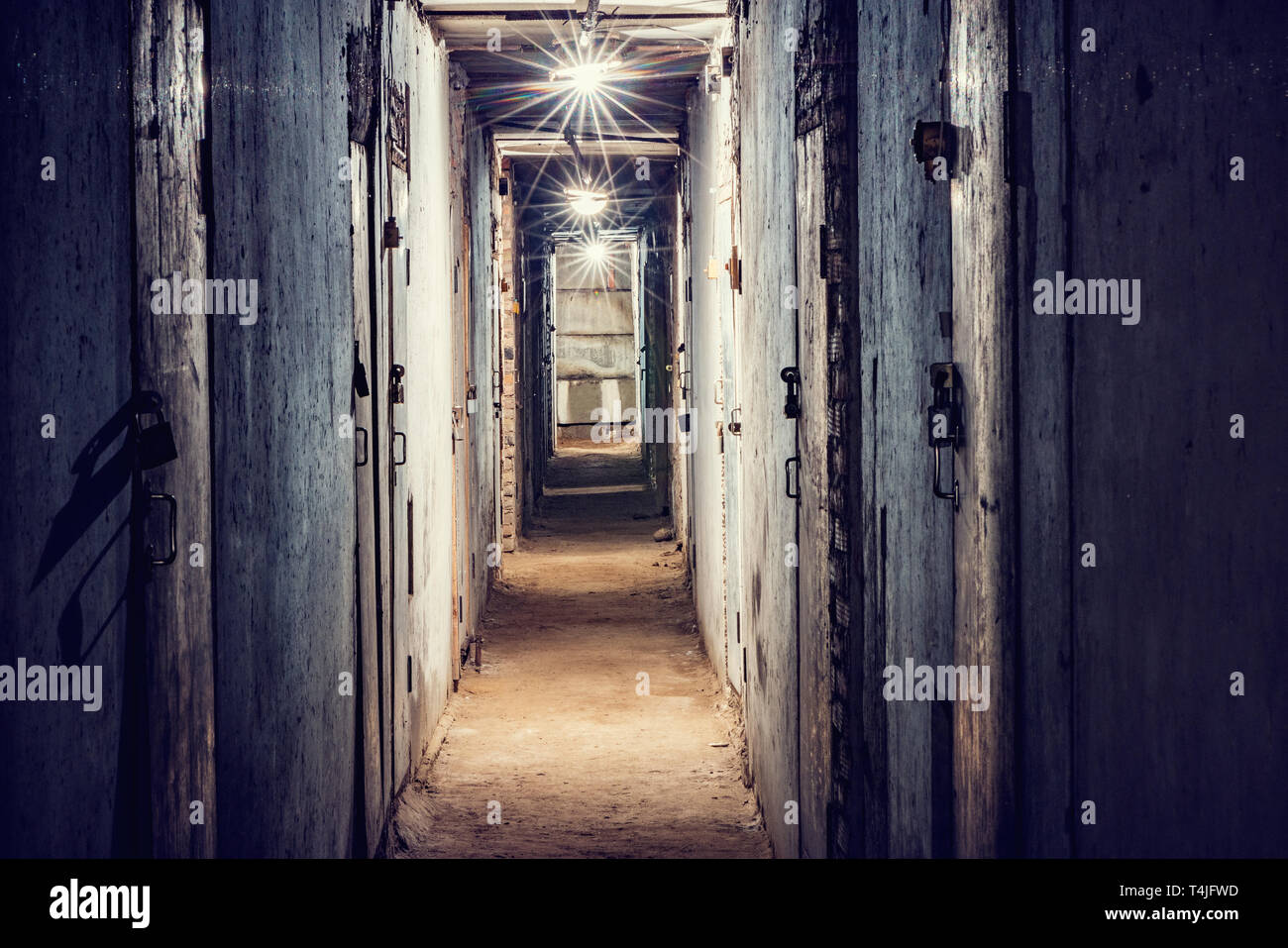 Dark narrow corridor of the basement Stock Photo - Alamy