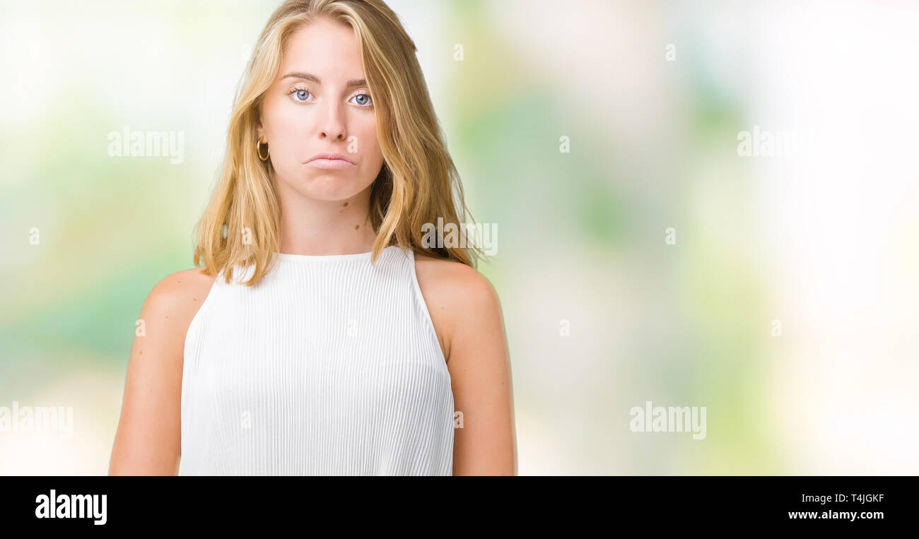 Beautiful young elegant woman over isolated background depressed and ...