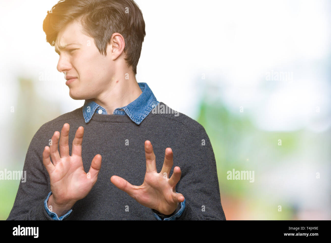 Young handsome elegant man over isolated background disgusted ...