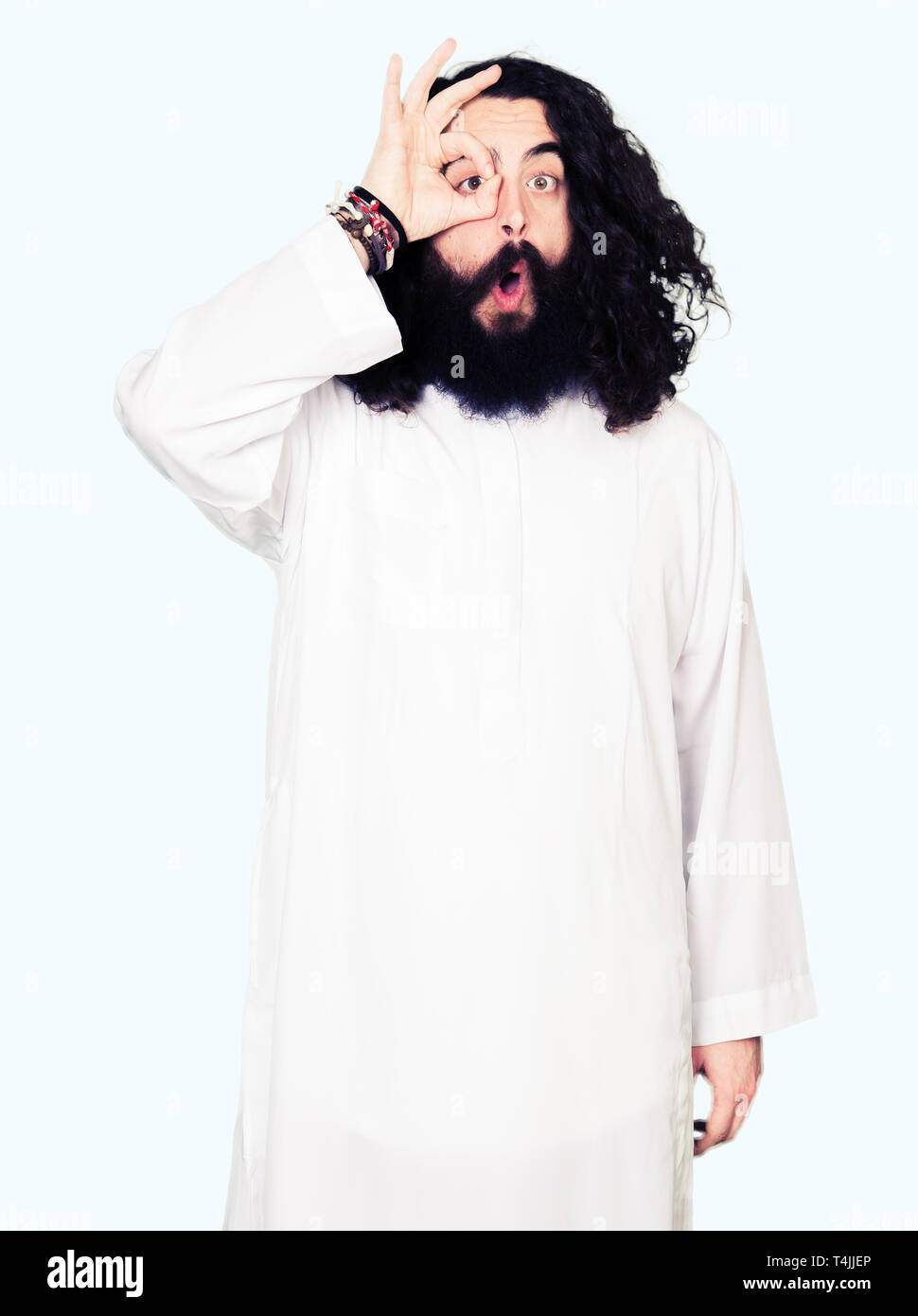 Man wearing Jesus Christ costume doing ok gesture shocked with ...