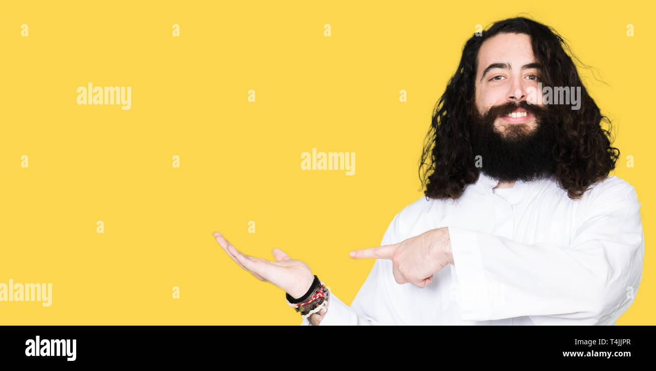 Man wearing Jesus Christ costume amazed and smiling to the camera while ...