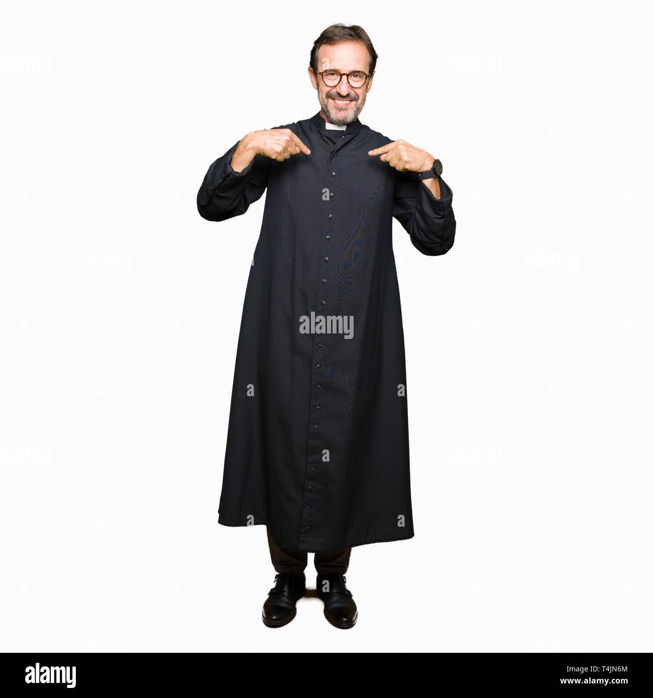 Middle age priest man wearing catholic robe looking confident with ...