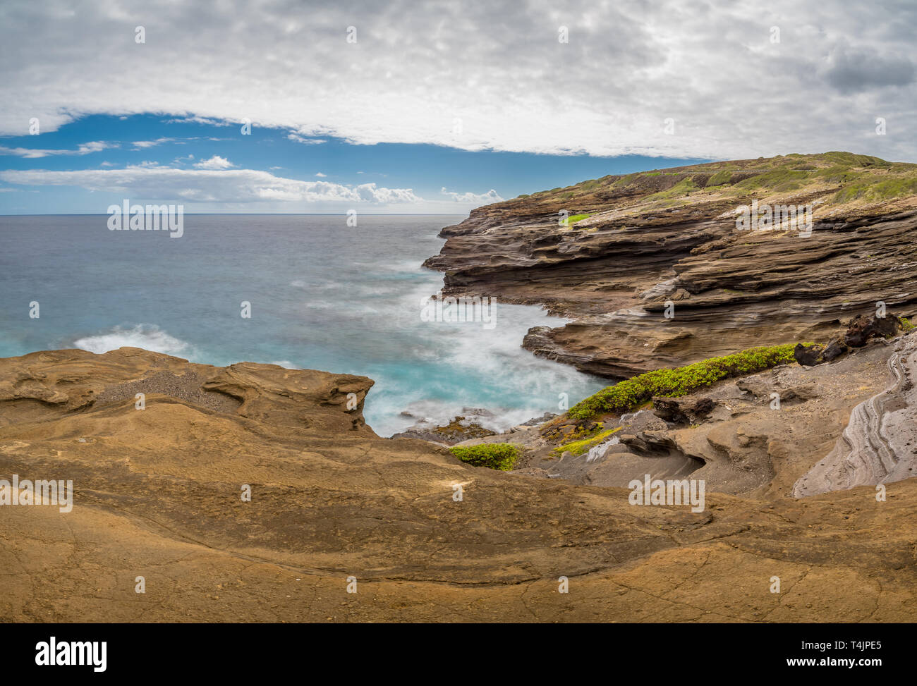 Ocean waves swirling around the unique lava rock formations of the ...
