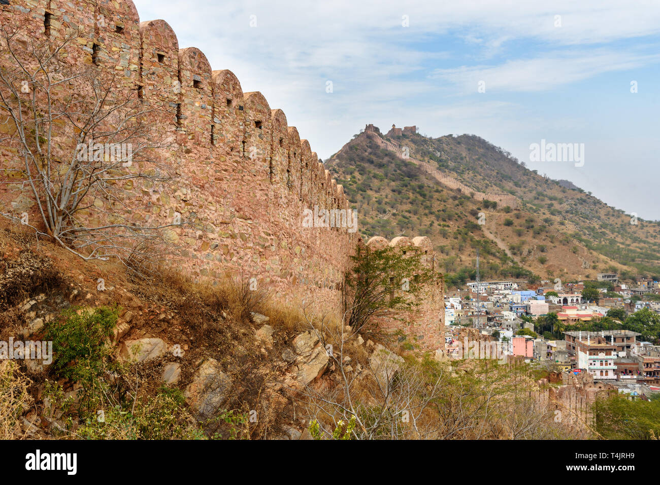 Ancient long wall with towers around Amber Fort and view of Amber ...