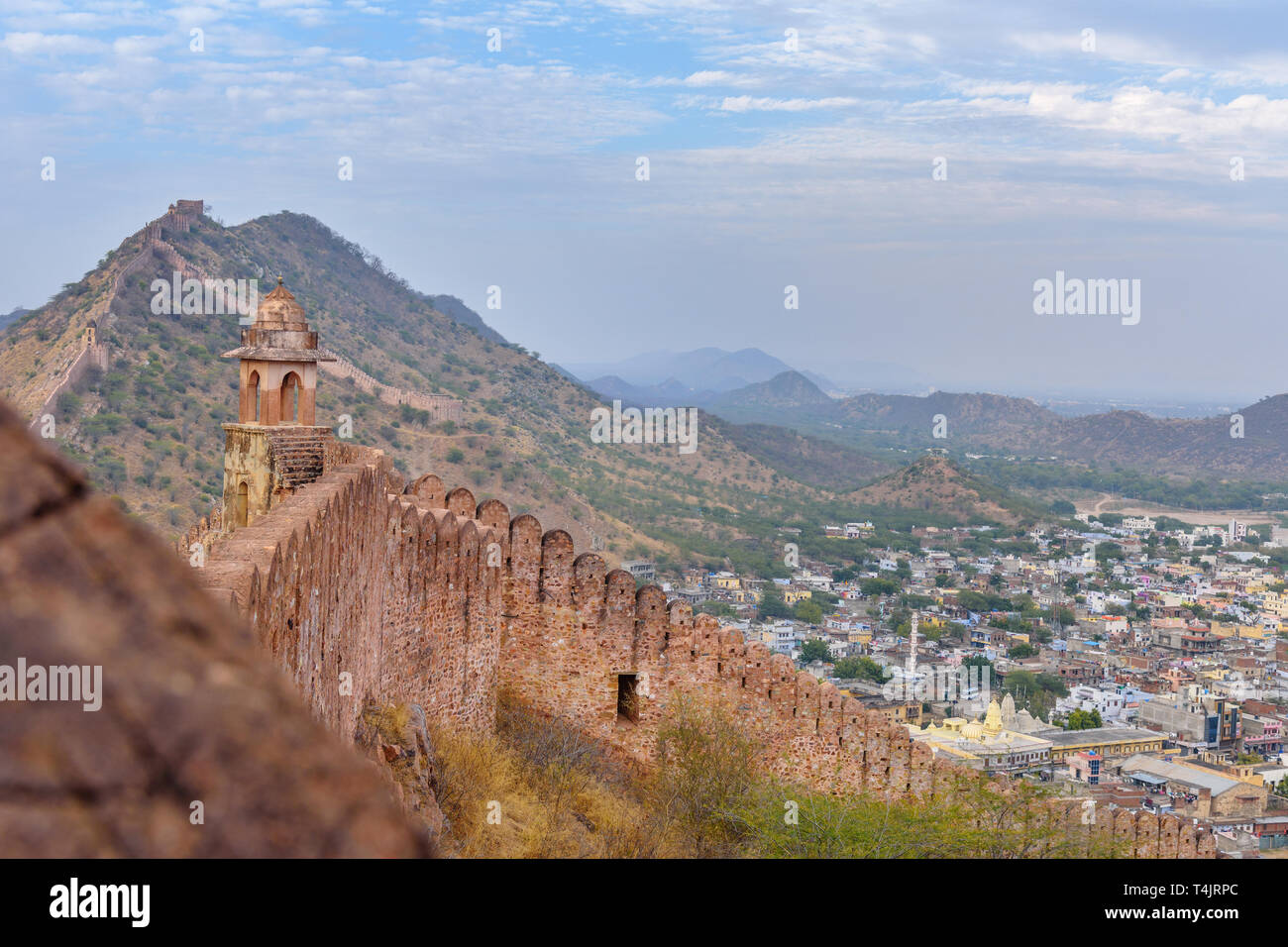 Ancient long wall with towers around Amber Fort and view of Amber ...