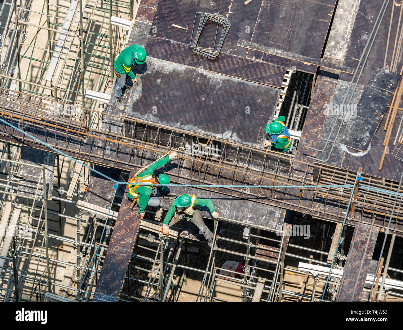 Construction Workers Working In The Building Philippines Stock Photo construction-workers-working-in-the-building-philippines-stock-photo