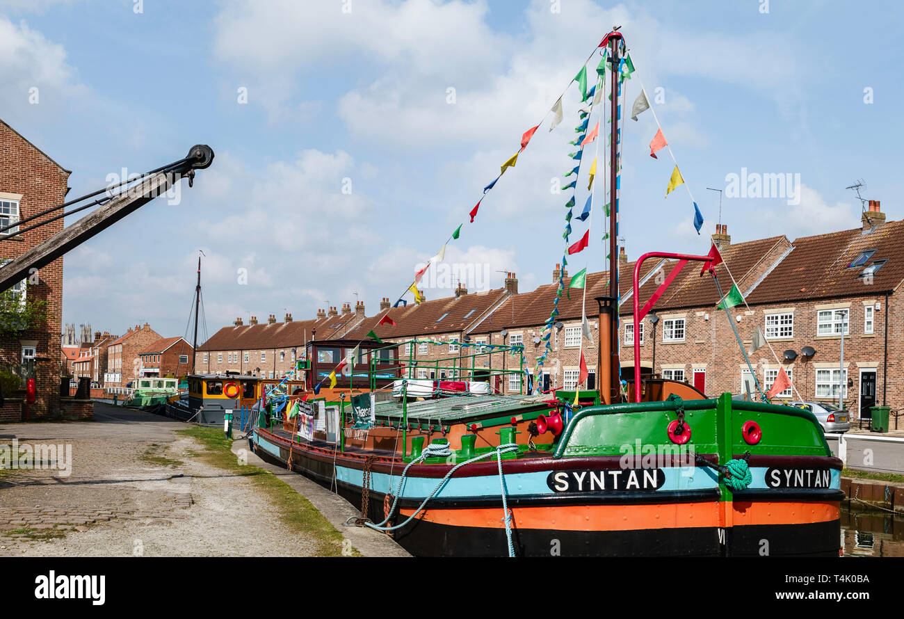 Restored river barge, Syntan, freshly painted and bedecked with flags ...