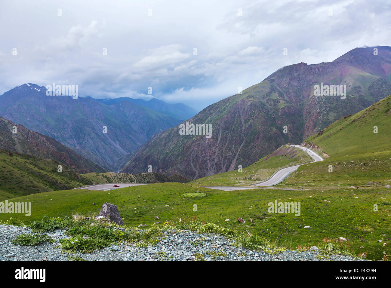 View of the mountains in the clouds from the pass. Mountain landscape ...