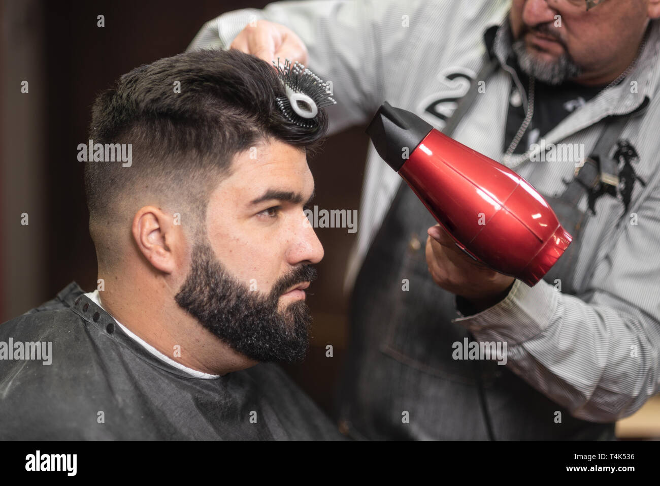 Barber doing hi-res stock photography and images - Alamy