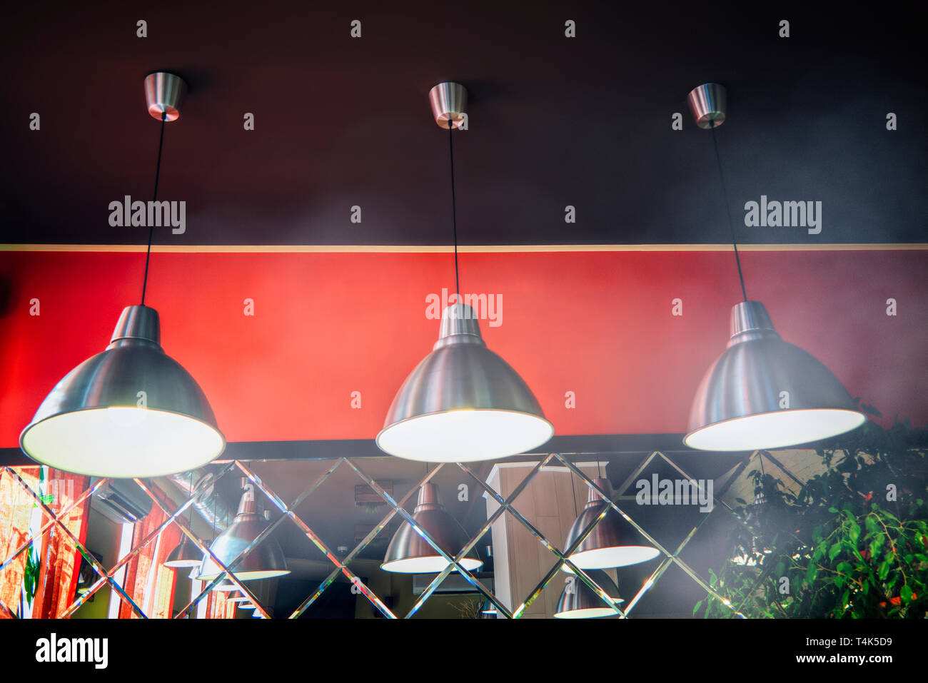 Lamp on the ceiling in cafe. The Ceiling lighting fixture in cafe ...