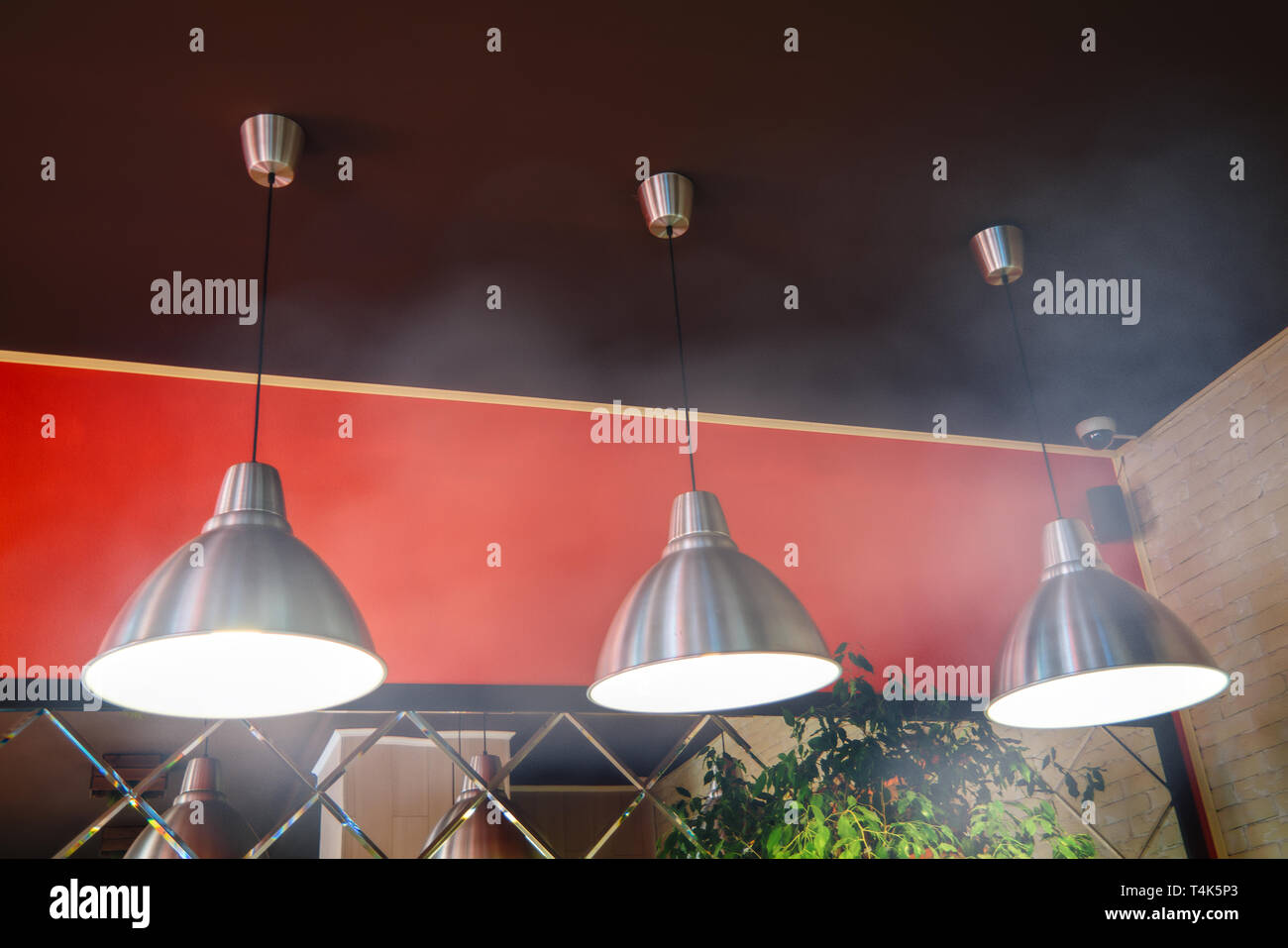 Lamp on the ceiling in cafe. The Ceiling lighting fixture in cafe ...