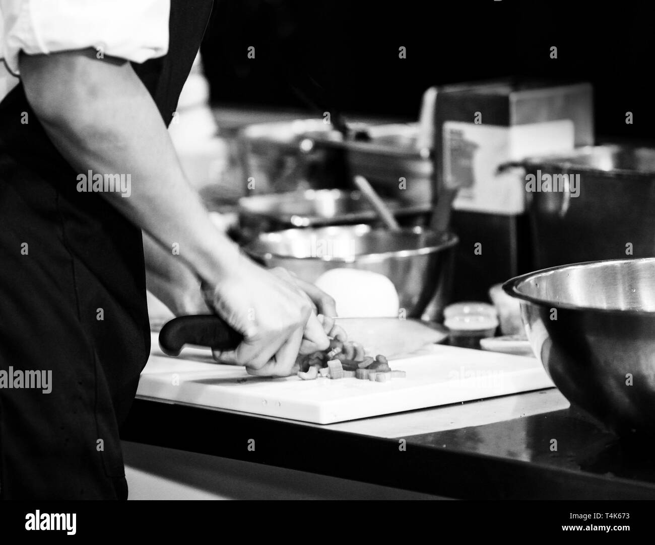 Chef cooking food in the kitchen, Chef preparing food Stock Photo - Alamy