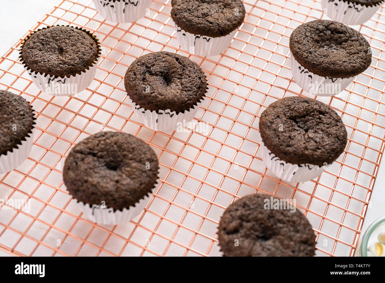 Cooling chocolate cupcakes before decorating them with icing Stock ...