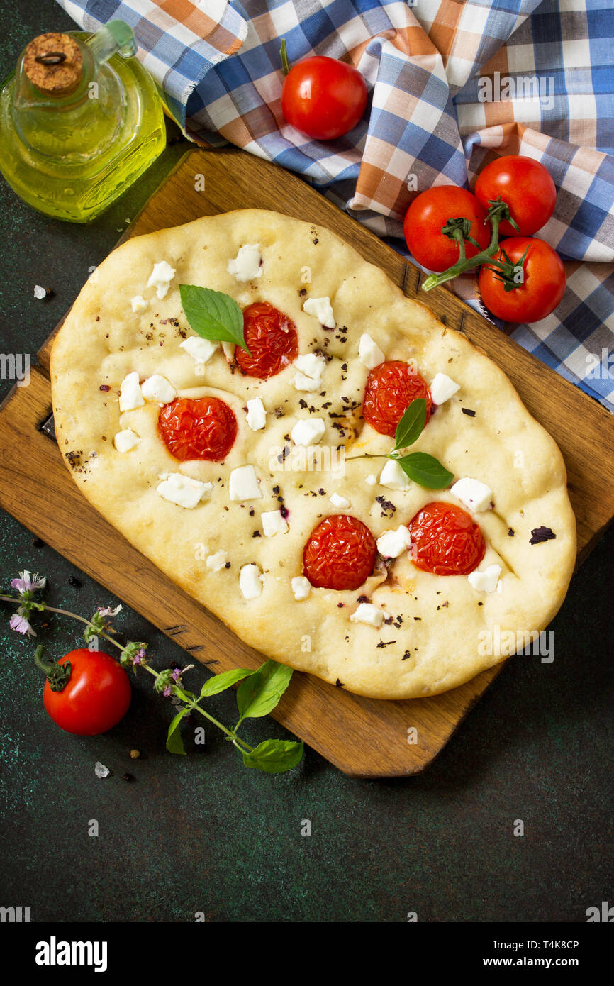Traditional Italian Focaccia with rosemary, tomatoes and feta ...